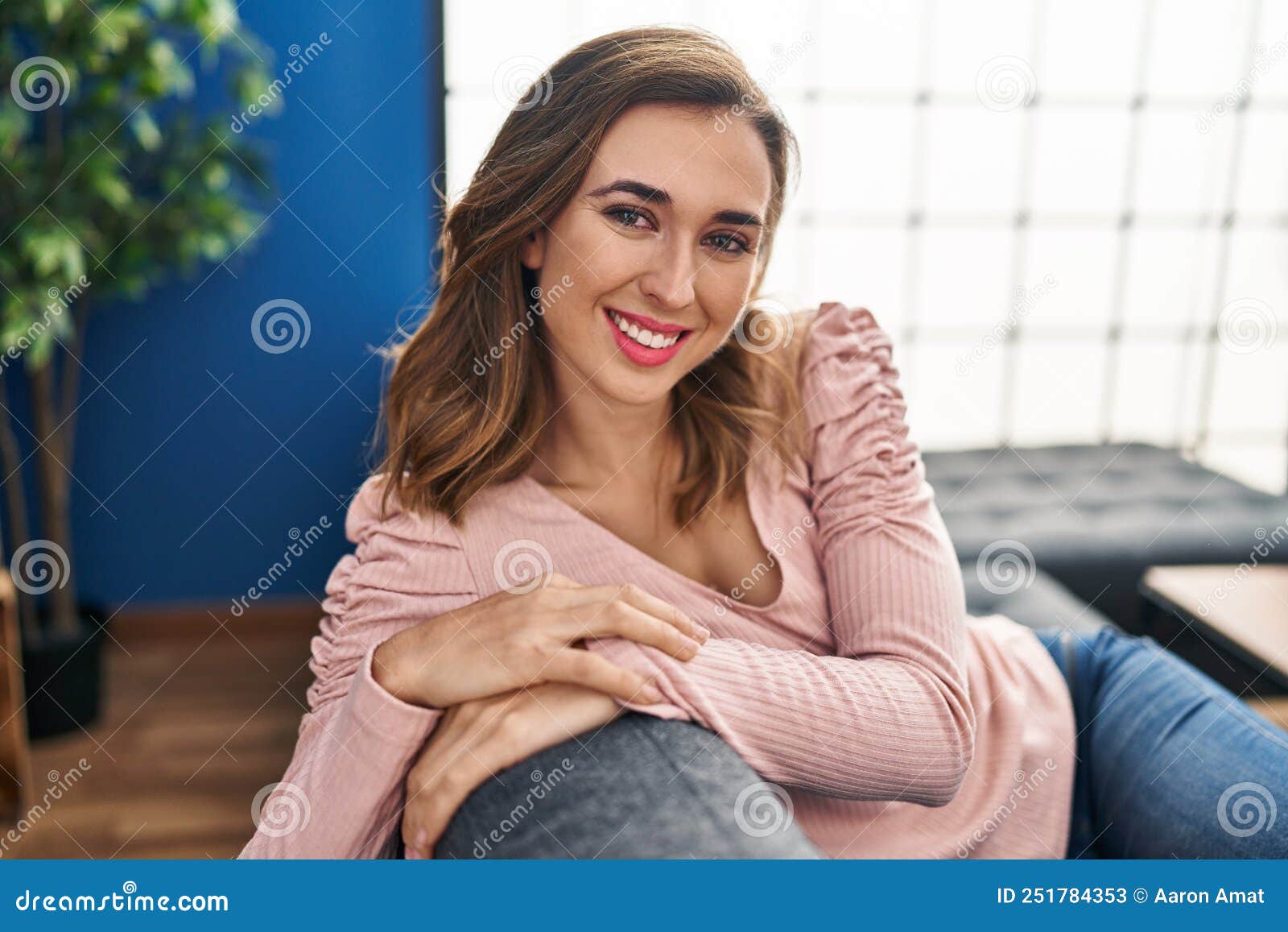 Young Woman Smiling Confident Sitting on Sofa at Home Stock Image ...