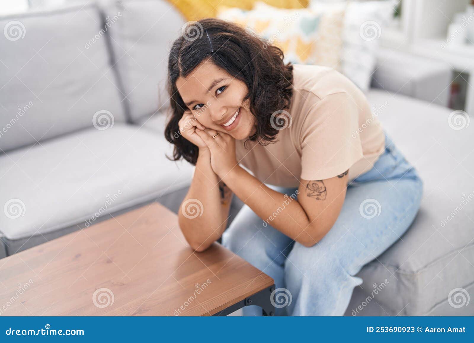 Young Woman Smiling Confident Sitting on Sofa at Home Stock Image ...