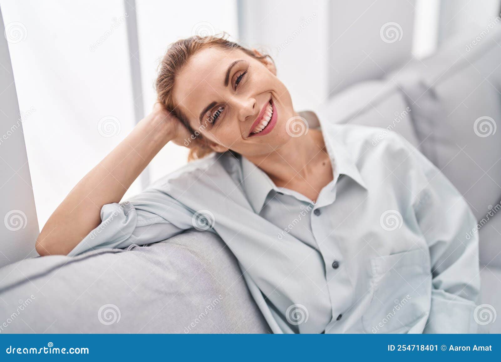 Young Woman Smiling Confident Sitting on Sofa at Home Stock Image ...