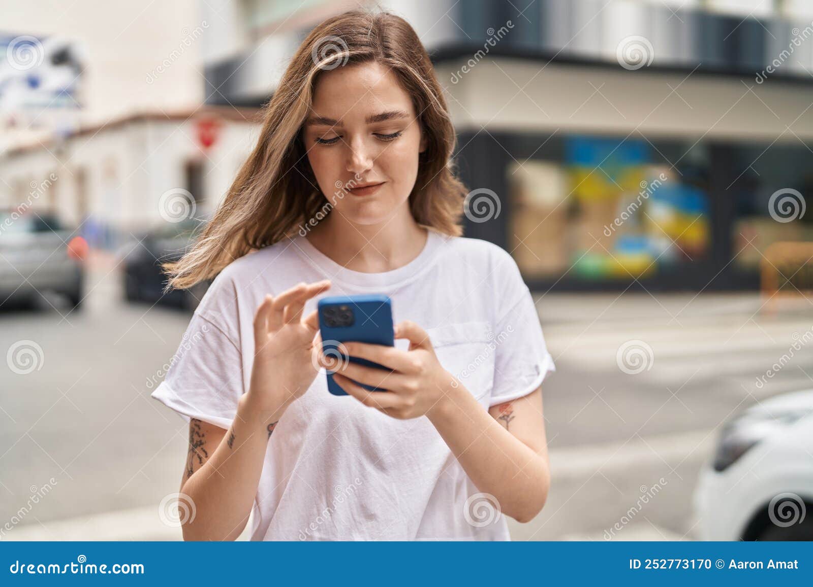 Young Woman Smiling Confident Using Smartphone at Street Stock Photo ...
