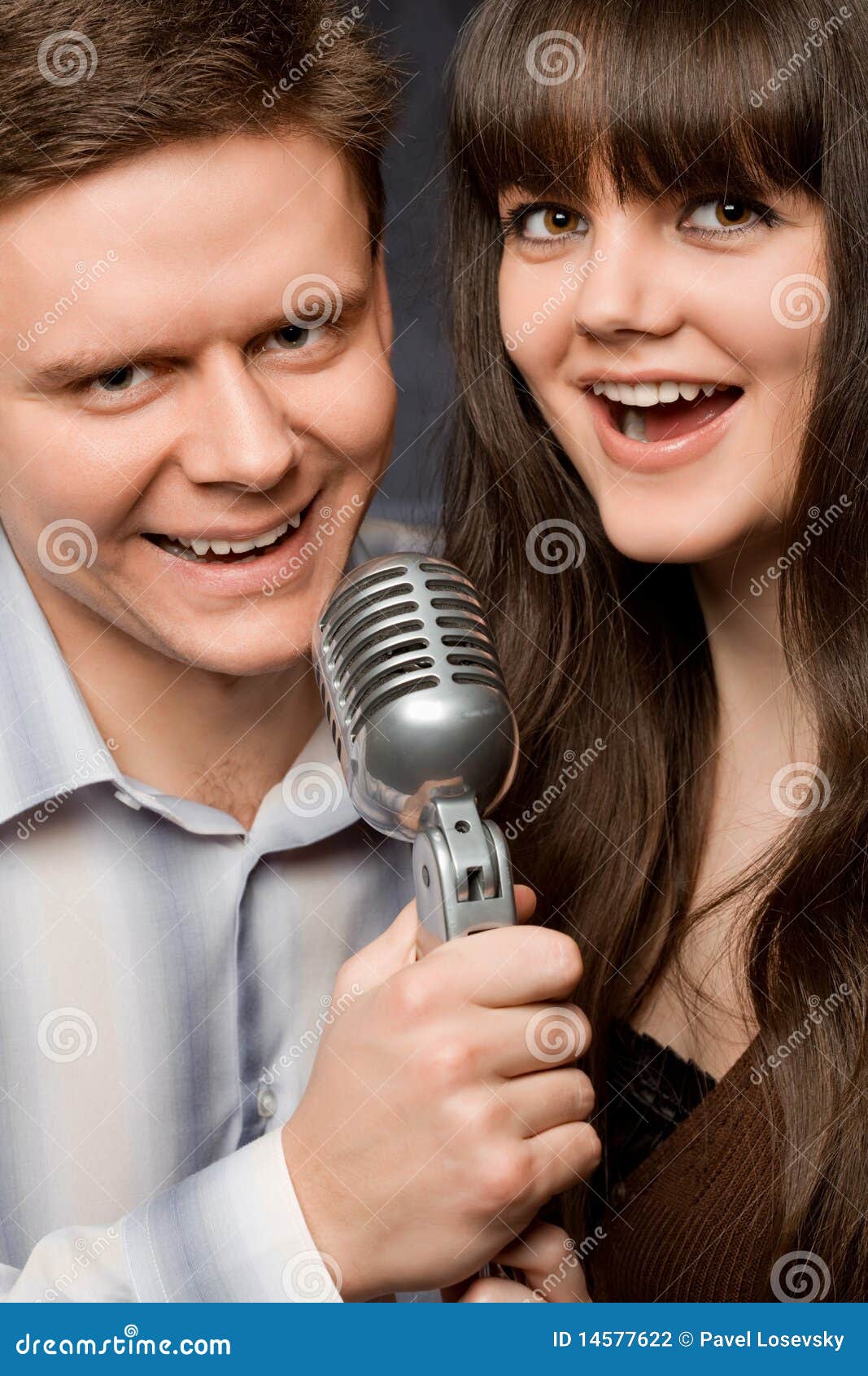 Young Woman and Smiling Man Sing in Microphone Stock Photo - Image of ...