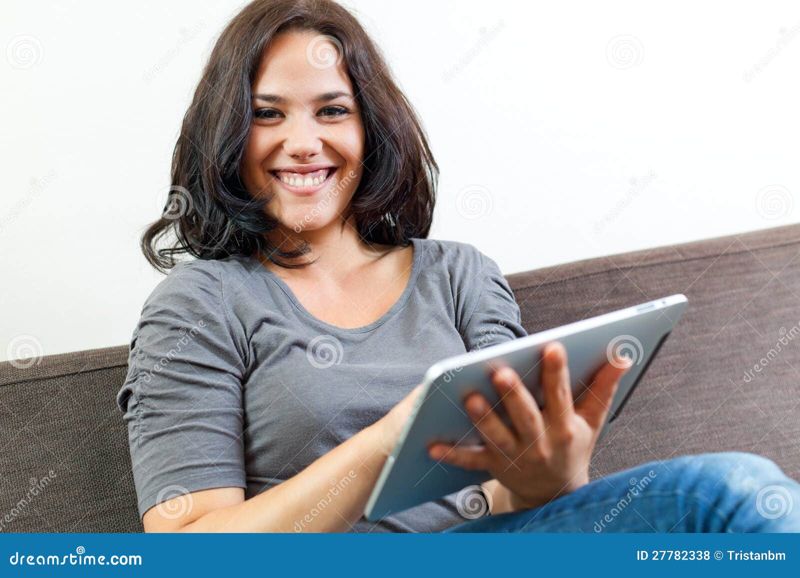 Young Woman Smiling while Using Touchpad Stock Photo - Image of person ...