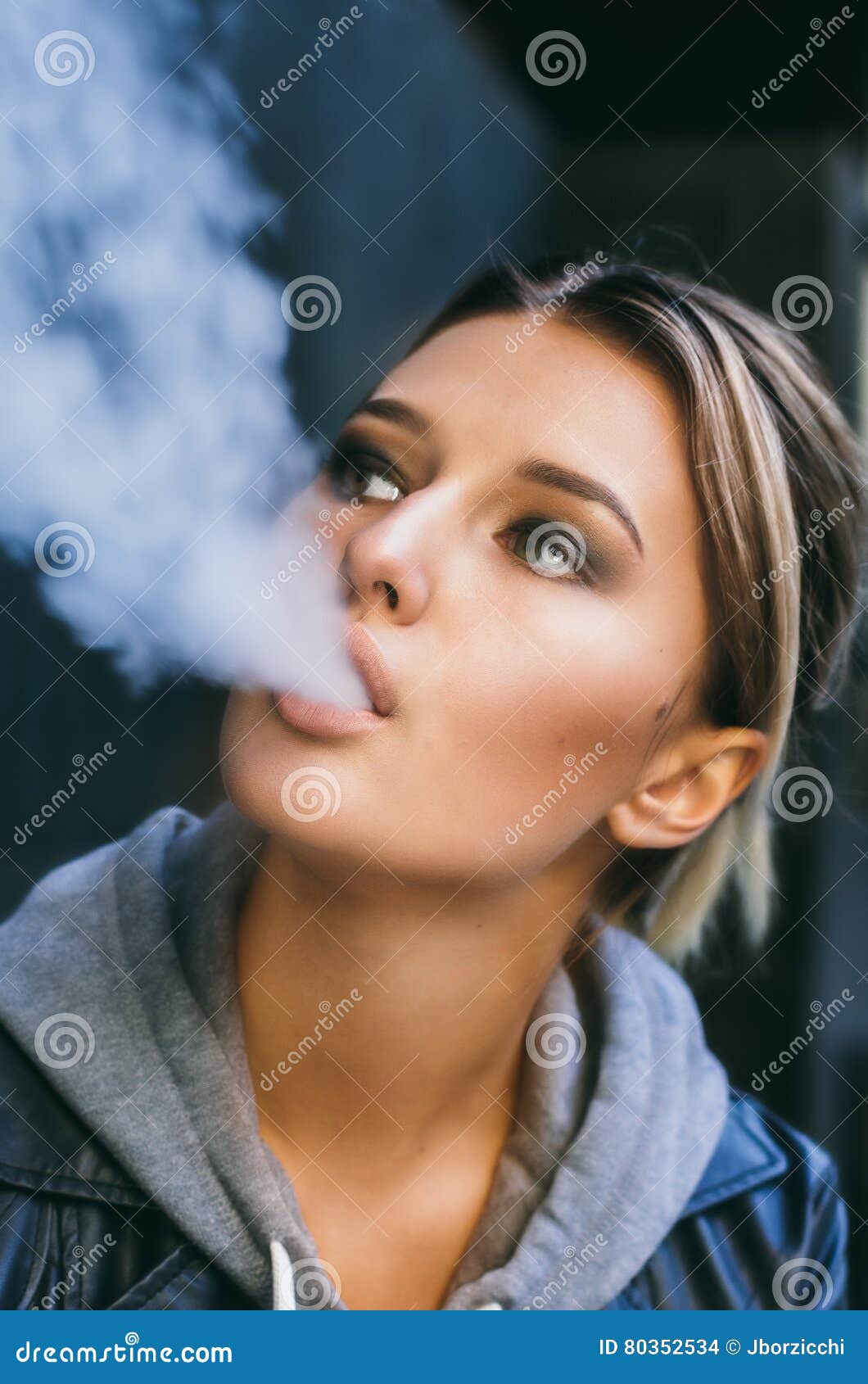 Young Woman Smoking Electronic Cigarette Stock Photo - Image of ...