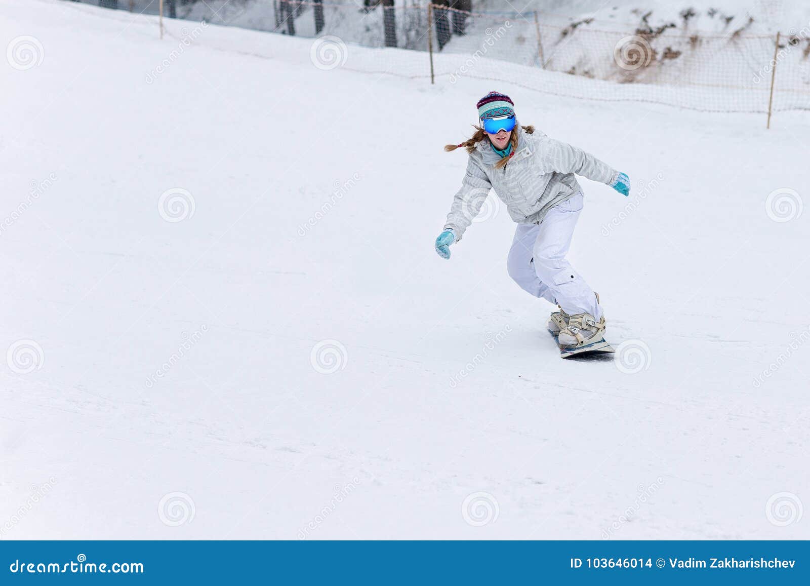 Young Woman Snowboarder in Motion on Snowboard in Mountains Stock Photo ...