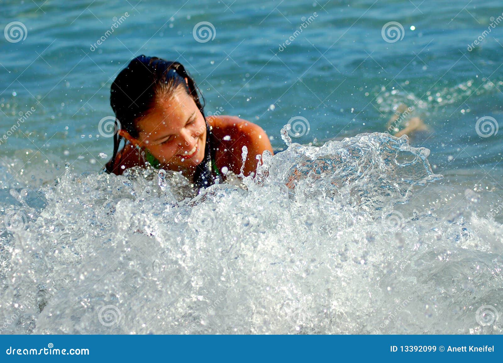 Young Woman in Splashing Waves Stock Image - Image of activity, nature ...