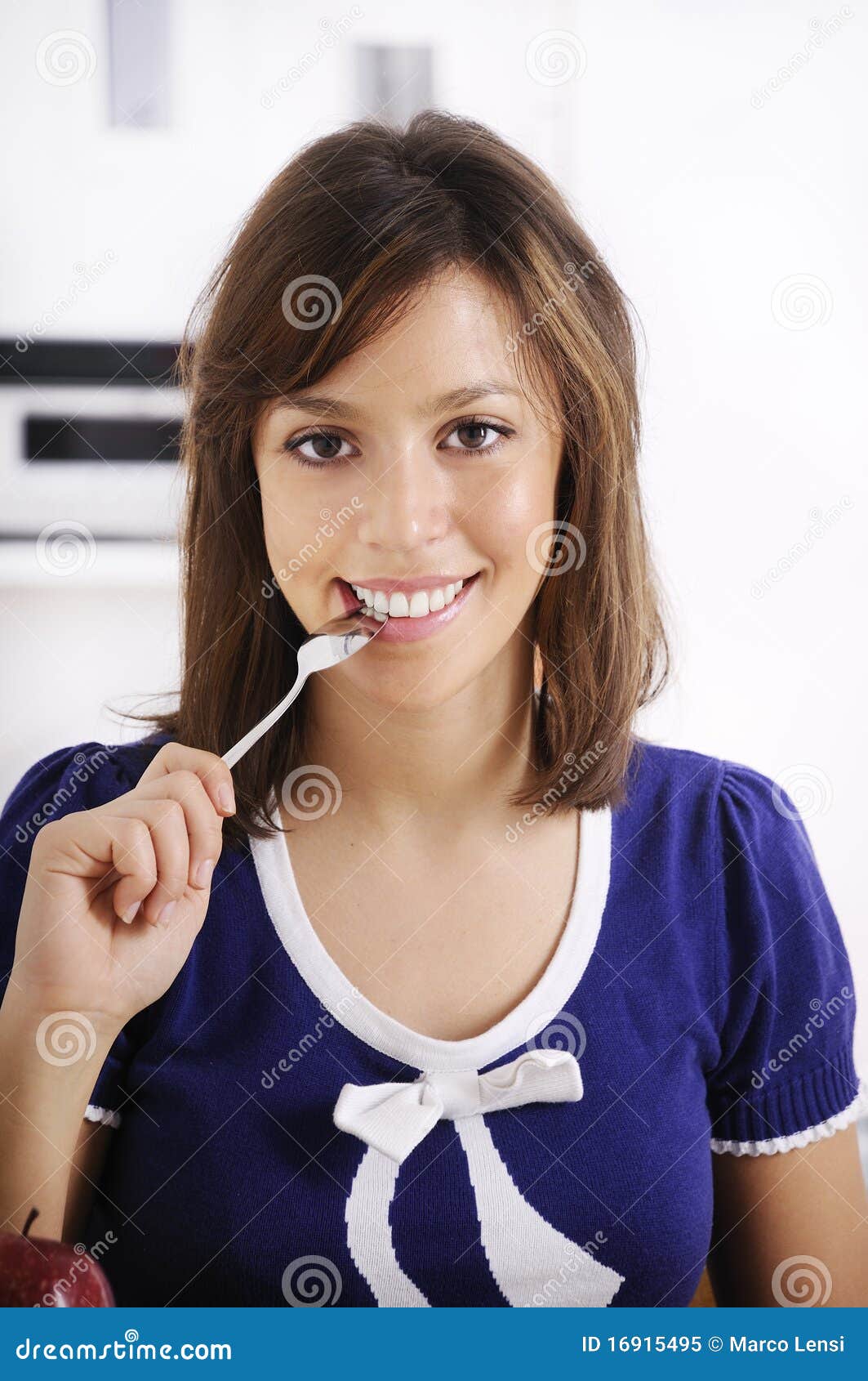 Young Woman with Spoon on Lips Stock Image - Image of beautiful ...