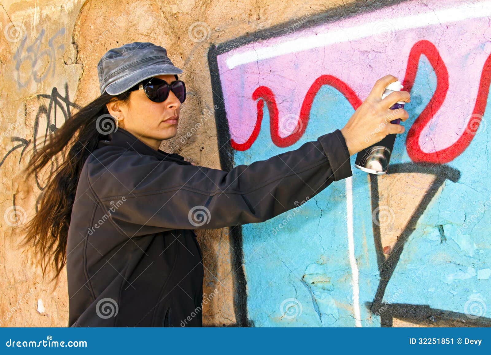Young Woman Spraying Paint on a Graffiti Wall Stock Image - Image of ...