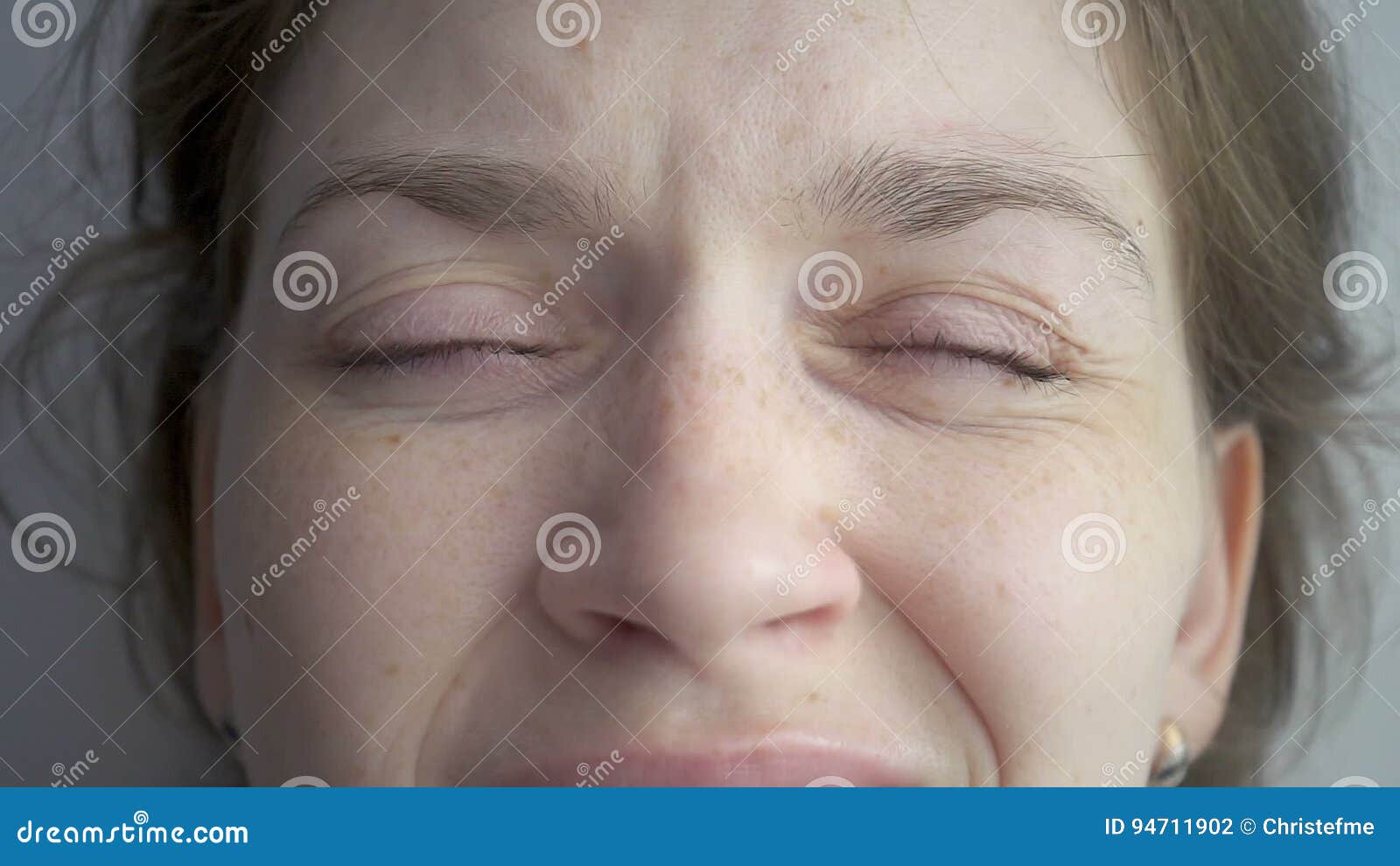Young Woman Squinting and Blinking Eyes Stock Footage - Video of motion ...