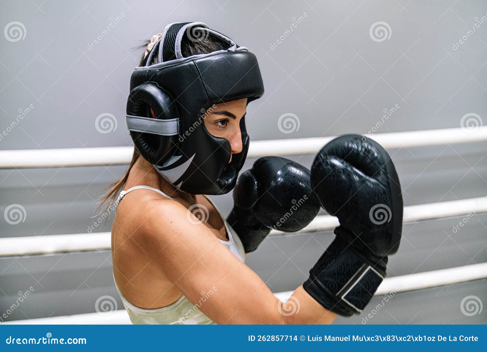 Young Woman Standing on a Boxing Ring in Guard Position Stock Photo ...