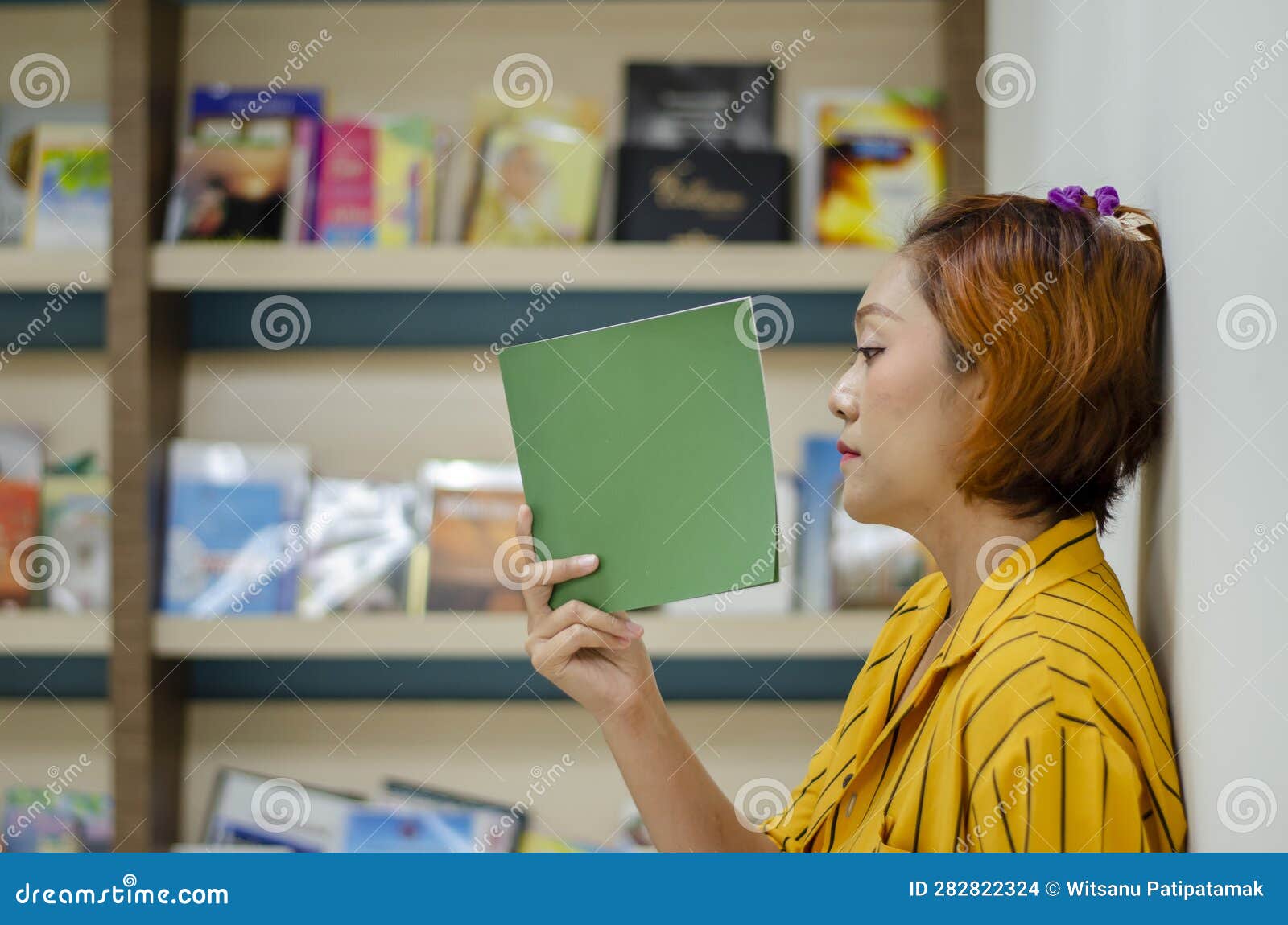 Young Woman Standing and Reading in the Library Stock Photo - Image of ...