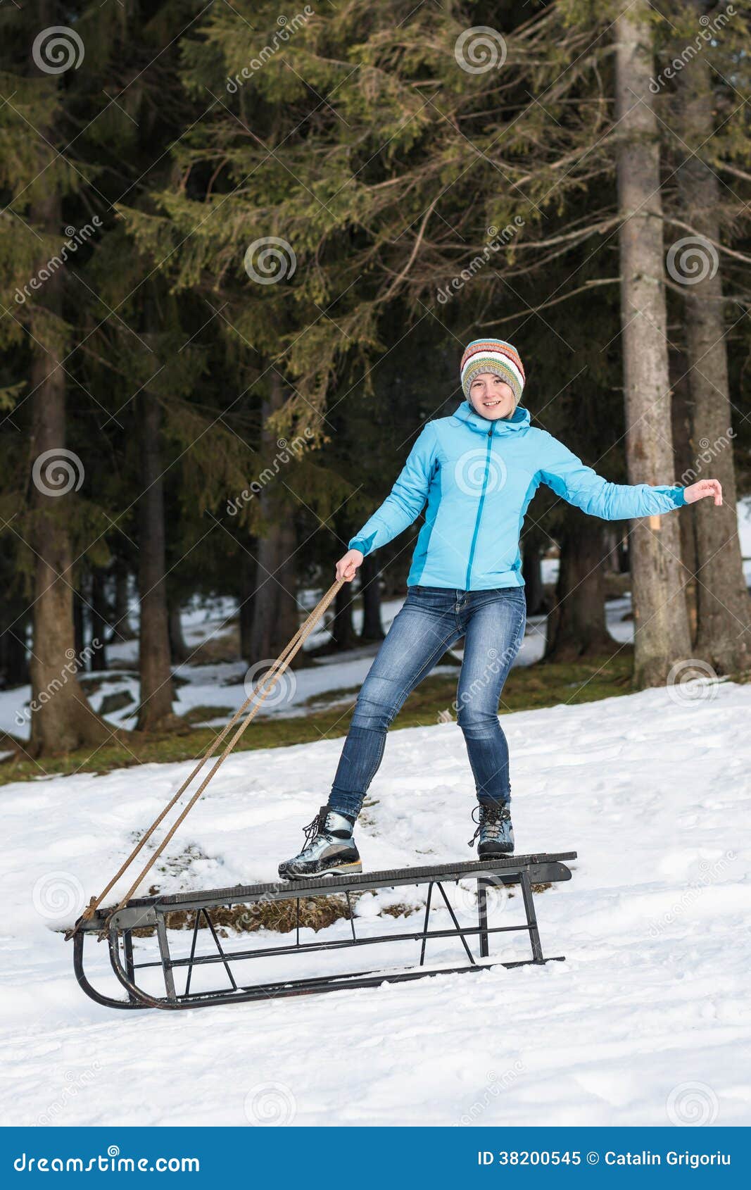 Young Woman Standing on a Sledge Stock Image - Image of posing ...