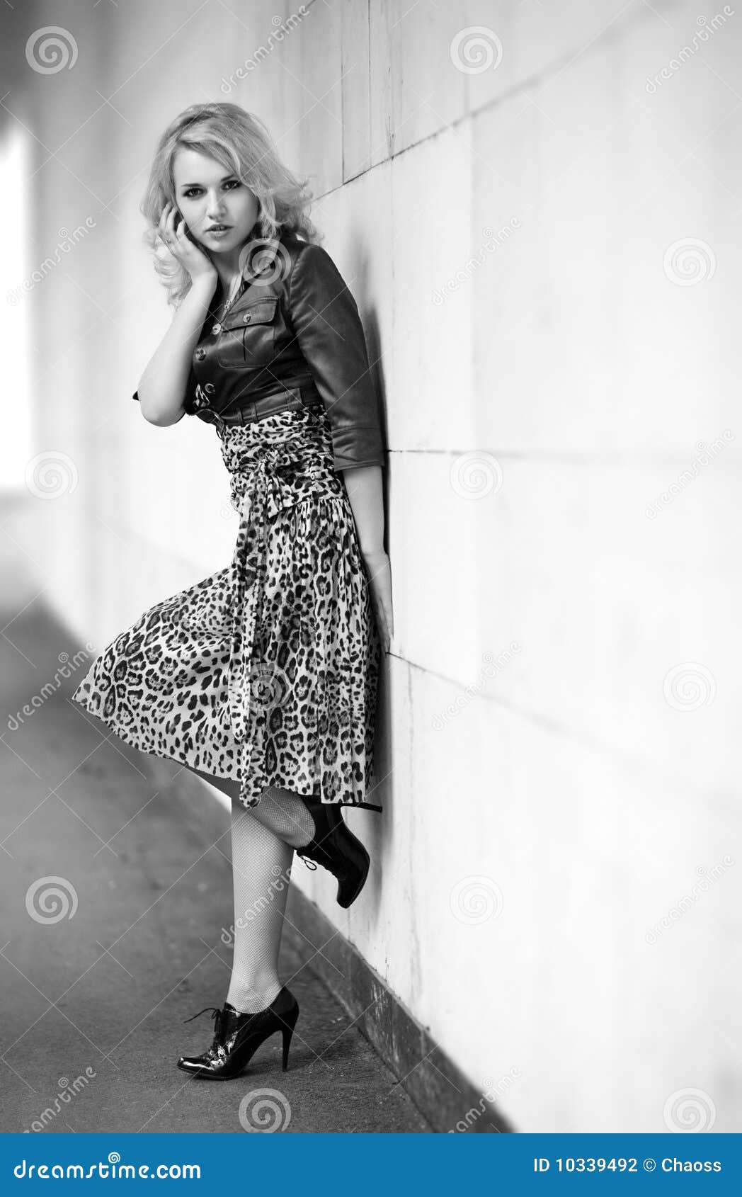 Young Woman Standing at the Wall Stock Photo - Image of beautiful ...