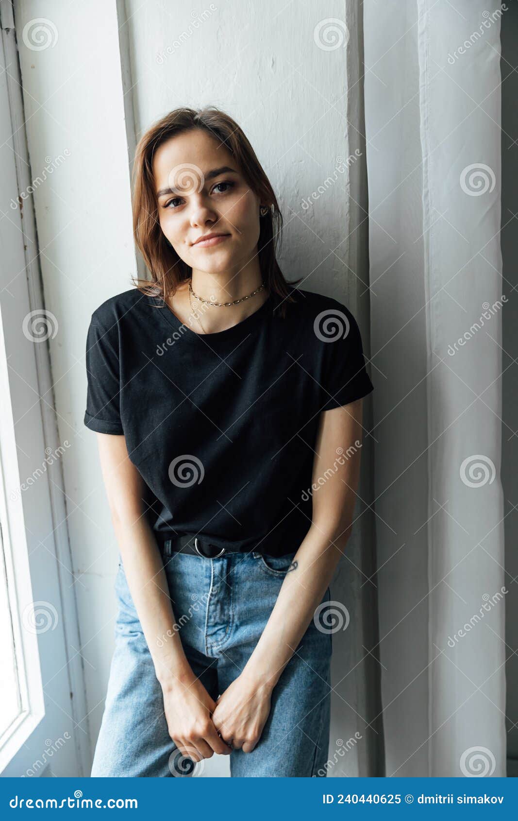 A Beautiful Young Woman Stands Next To a Window Stock Image - Image of ...