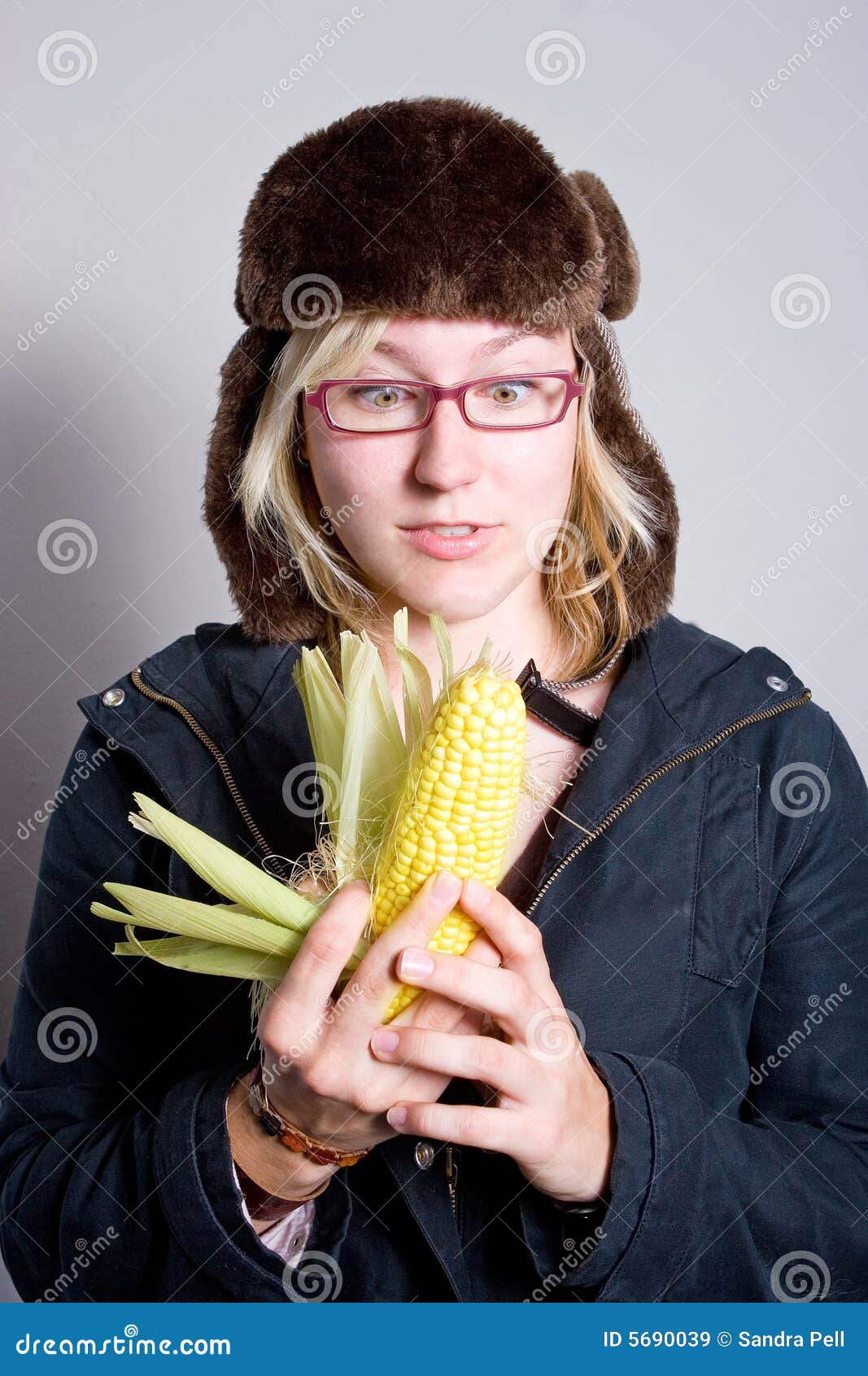Young Woman Staring at Cob of Corn. Stock Image - Image of hungry ...
