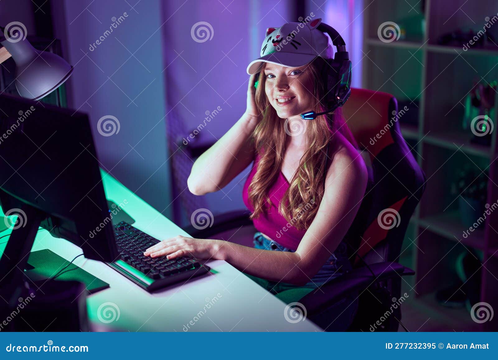 Young Woman Streamer Using Computer and Headphones at Gaming Room Stock ...