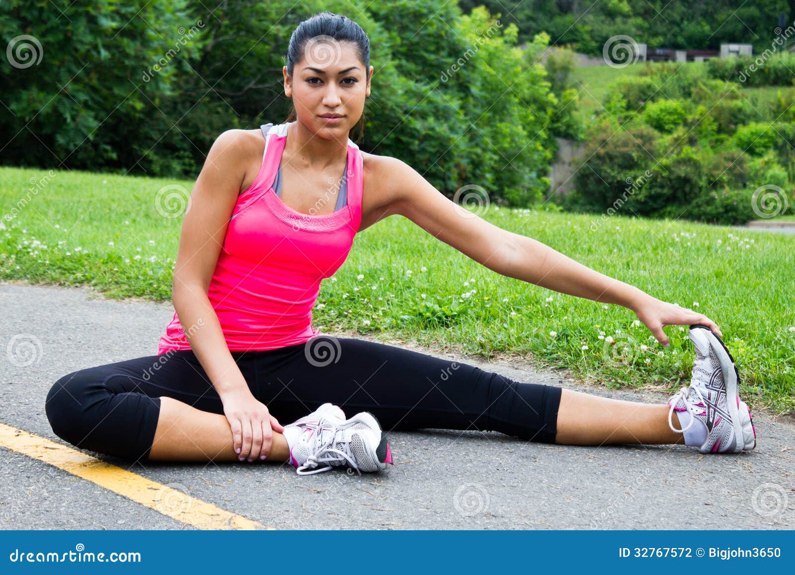 Young Woman Stretches before Jogging Stock Photo - Image of exercise ...