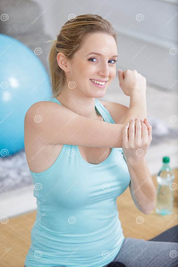 Young Woman Stretching Arms After Sport Stock Image Image Of Grey