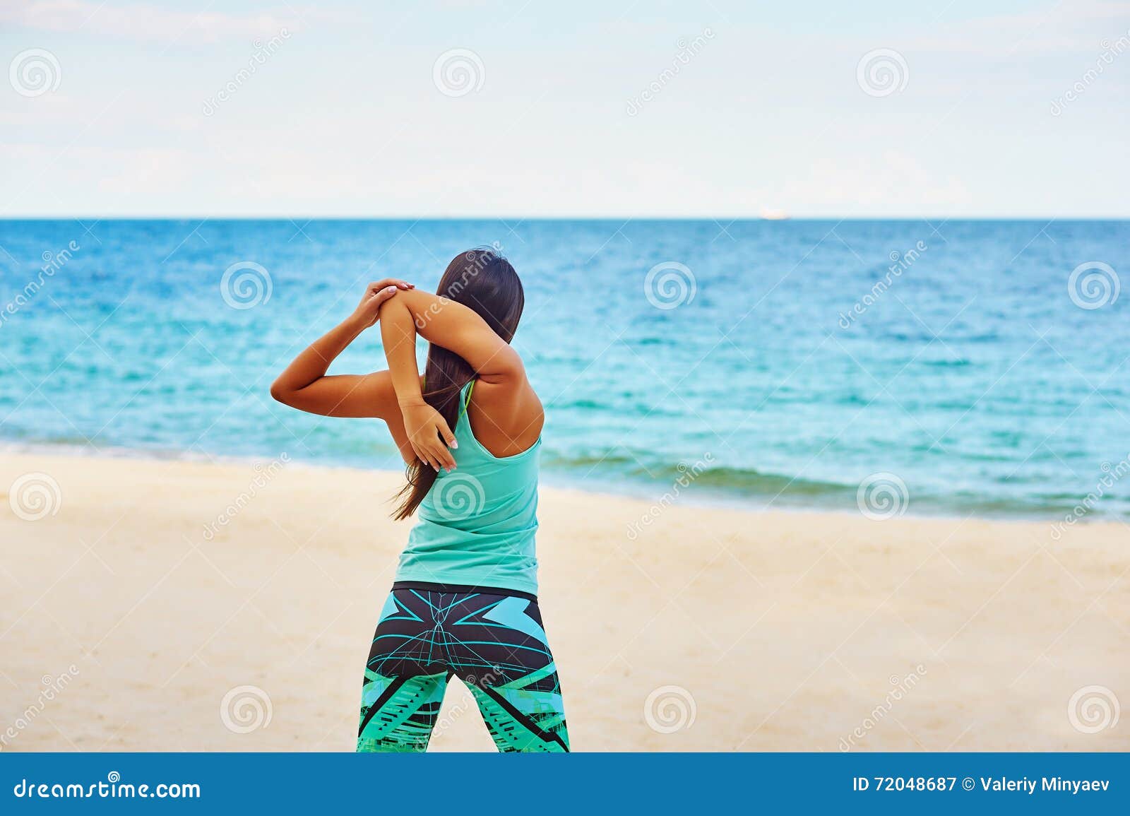 Young Woman Stretching on the Beach Stock Image - Image of stretching ...