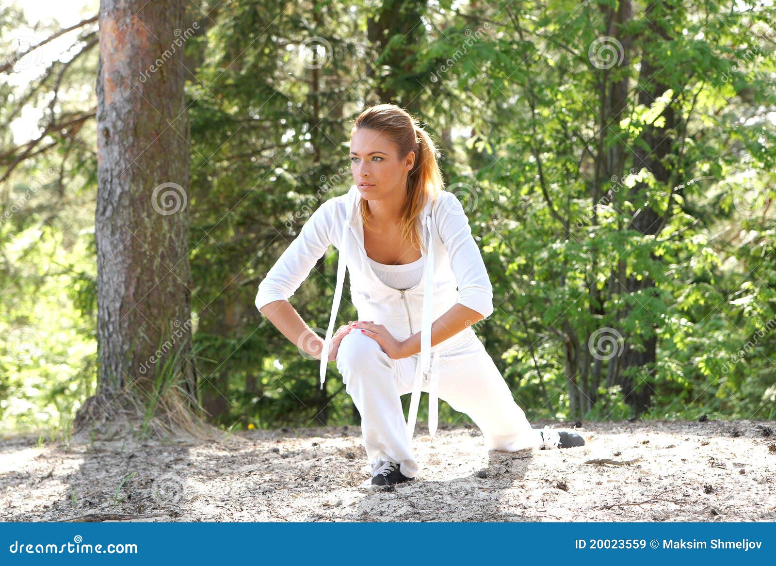 A Young Woman Stretching Her Leg in the Forest Stock Image - Image of ...
