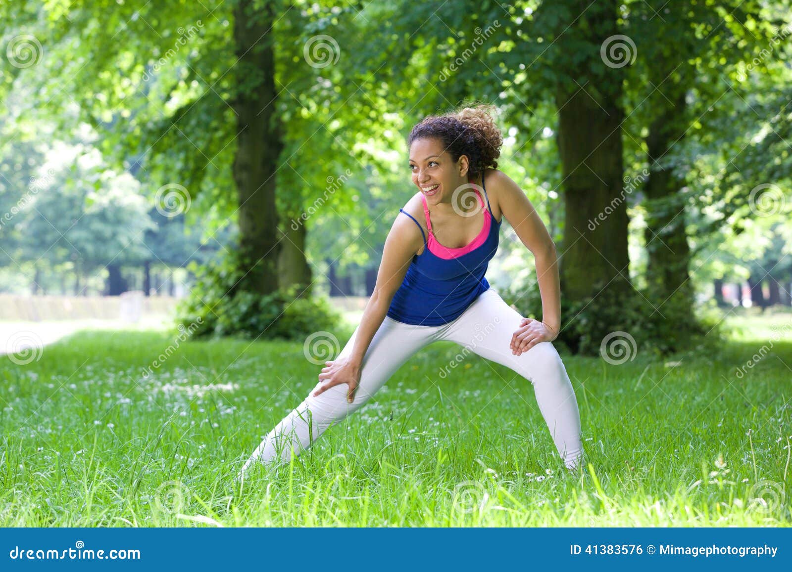 Young Woman Stretching Outdoors Stock Photo - Image of clothes, outside ...