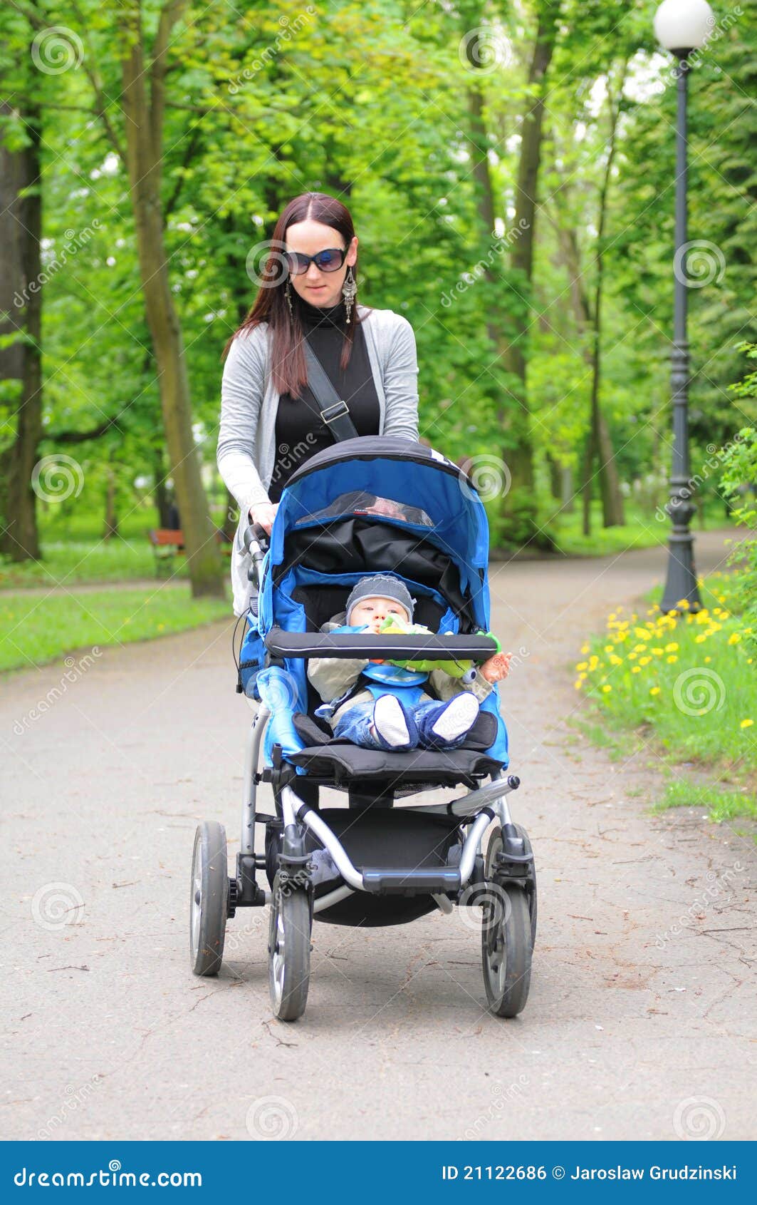 Young Woman with a Stroller Stock Photo - Image of green, activity ...