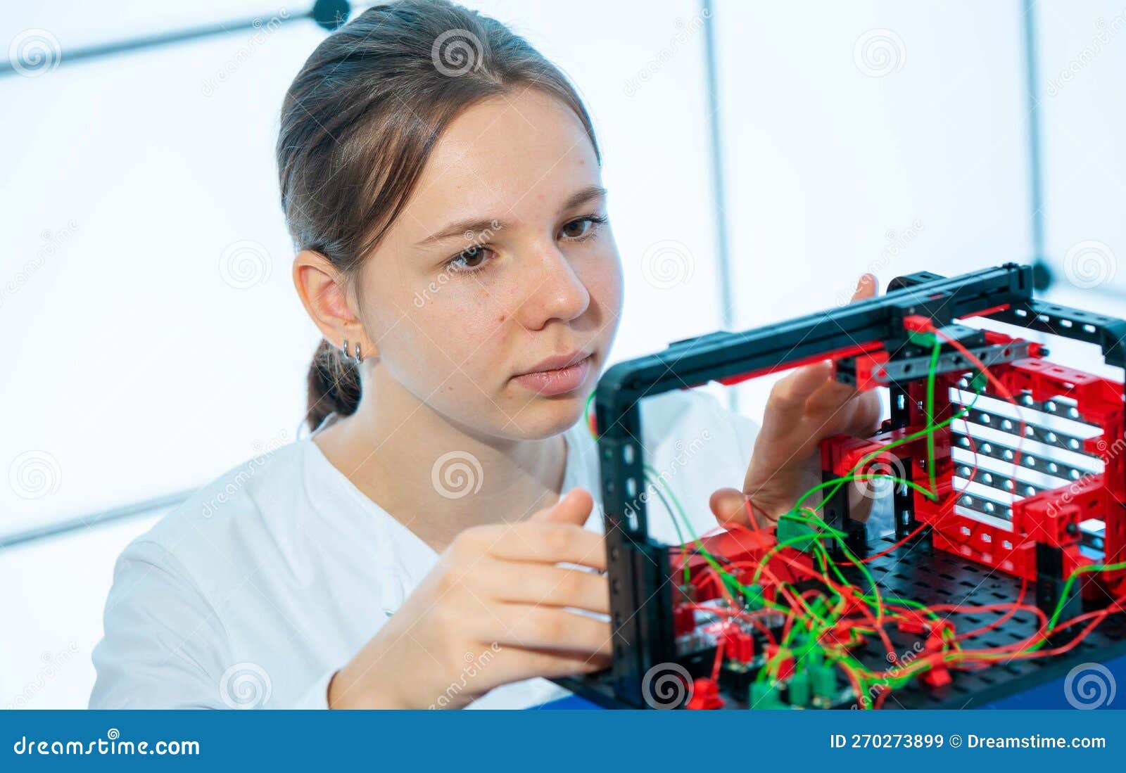 Young Woman Student Assembling Electronic Devices in the Robotics ...