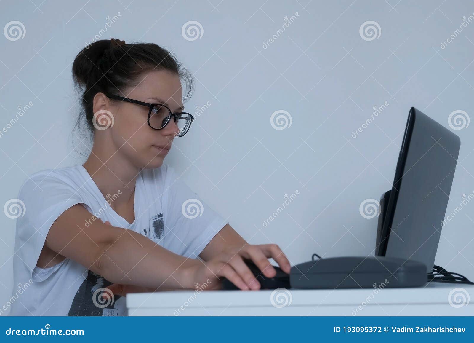 Young Woman Student is Learning Language on Laptop Sitting at Home in ...
