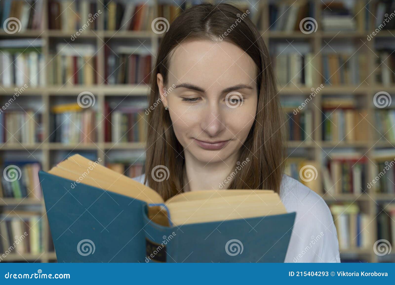 Young Woman Student Reading a Book in a Library Stock Image - Image of ...
