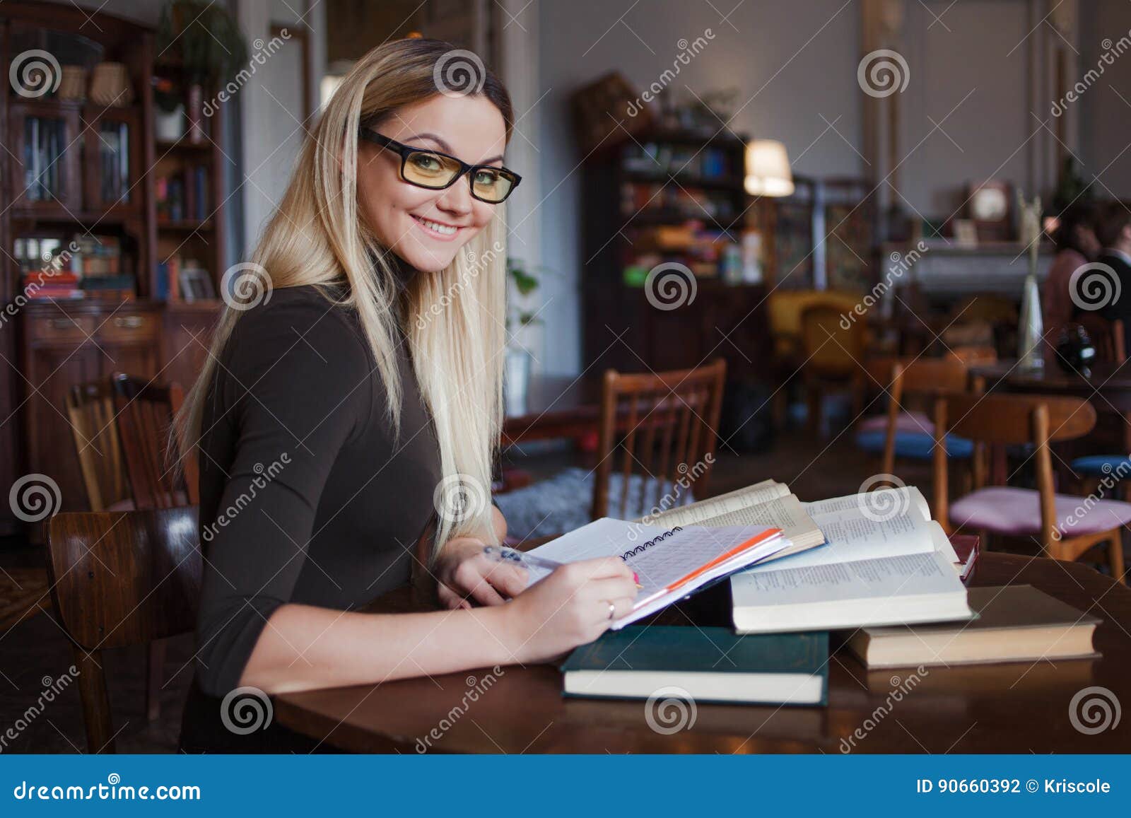 Young Woman Student of the University. Preparing Exam and Learning ...