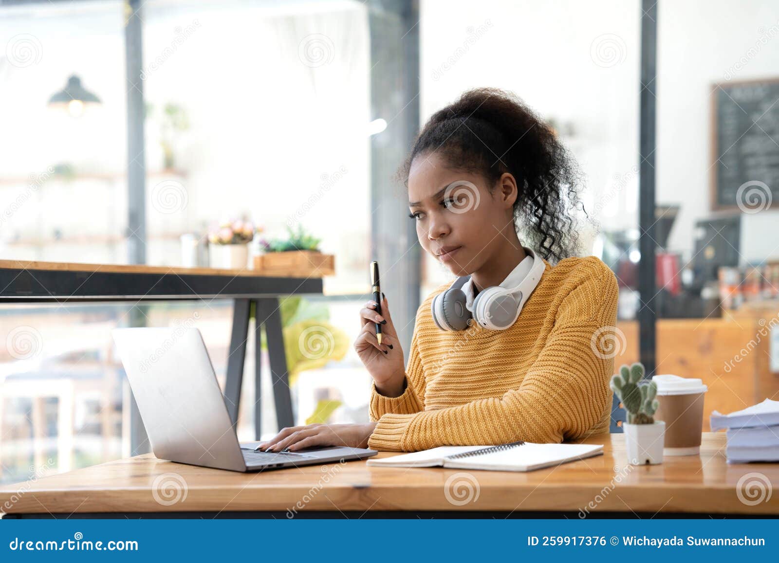 Young Woman Student Using Computer and Mobile Device Studying Online ...