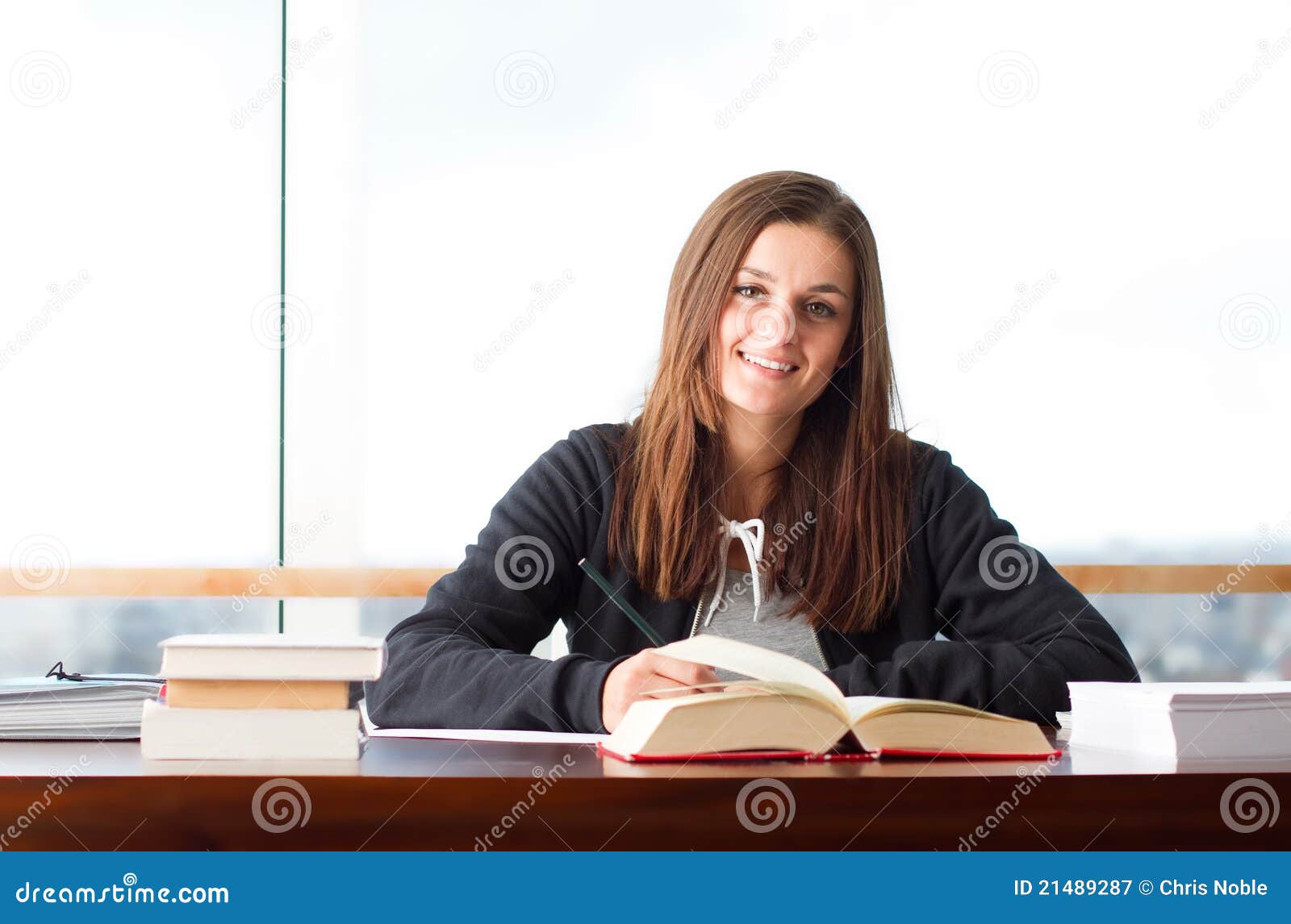 Young woman studying stock image. Image of thinking, toothy - 21489287