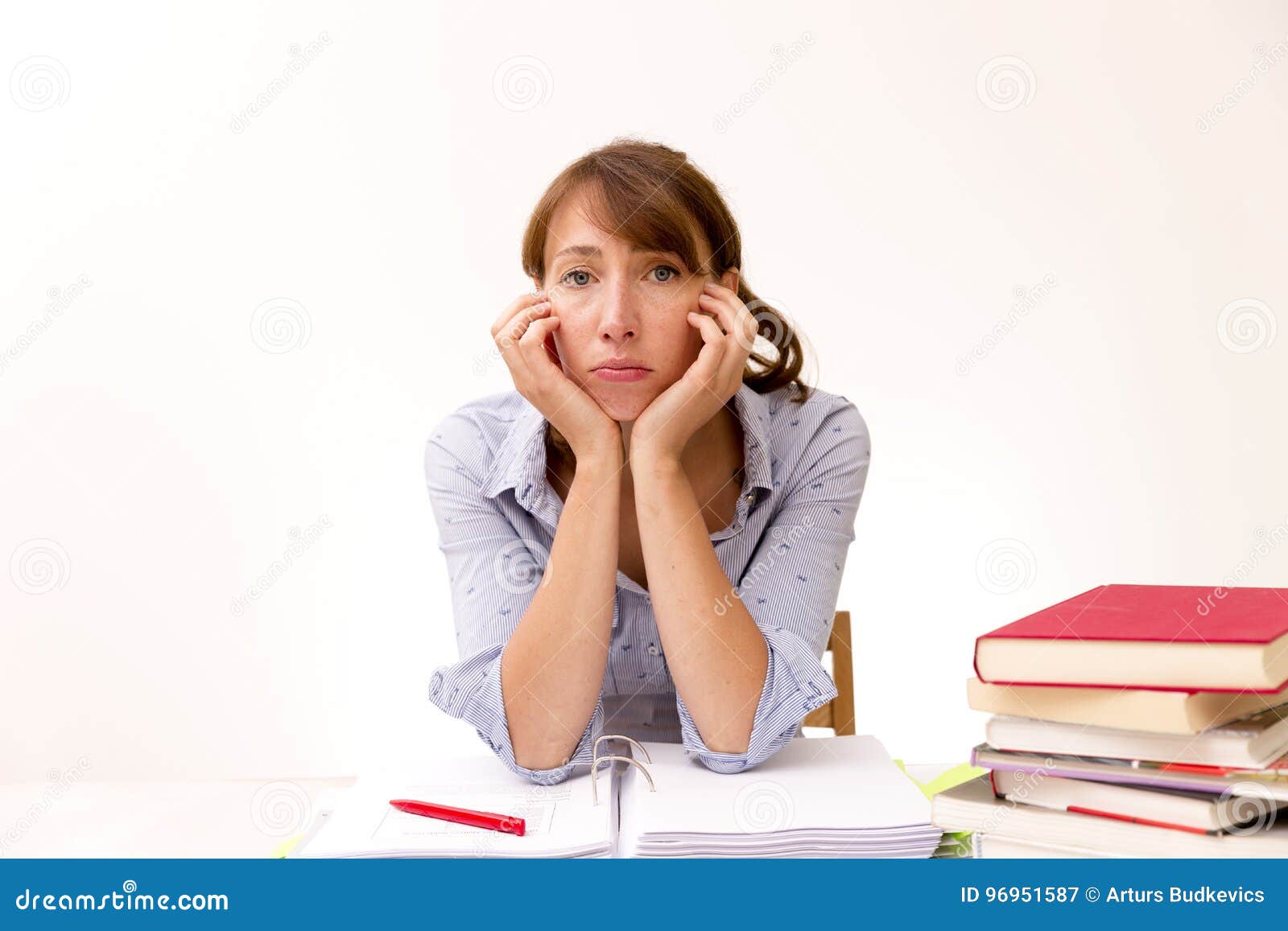 Young Woman Studying and Reading in a Library but is Having a Hard Time ...