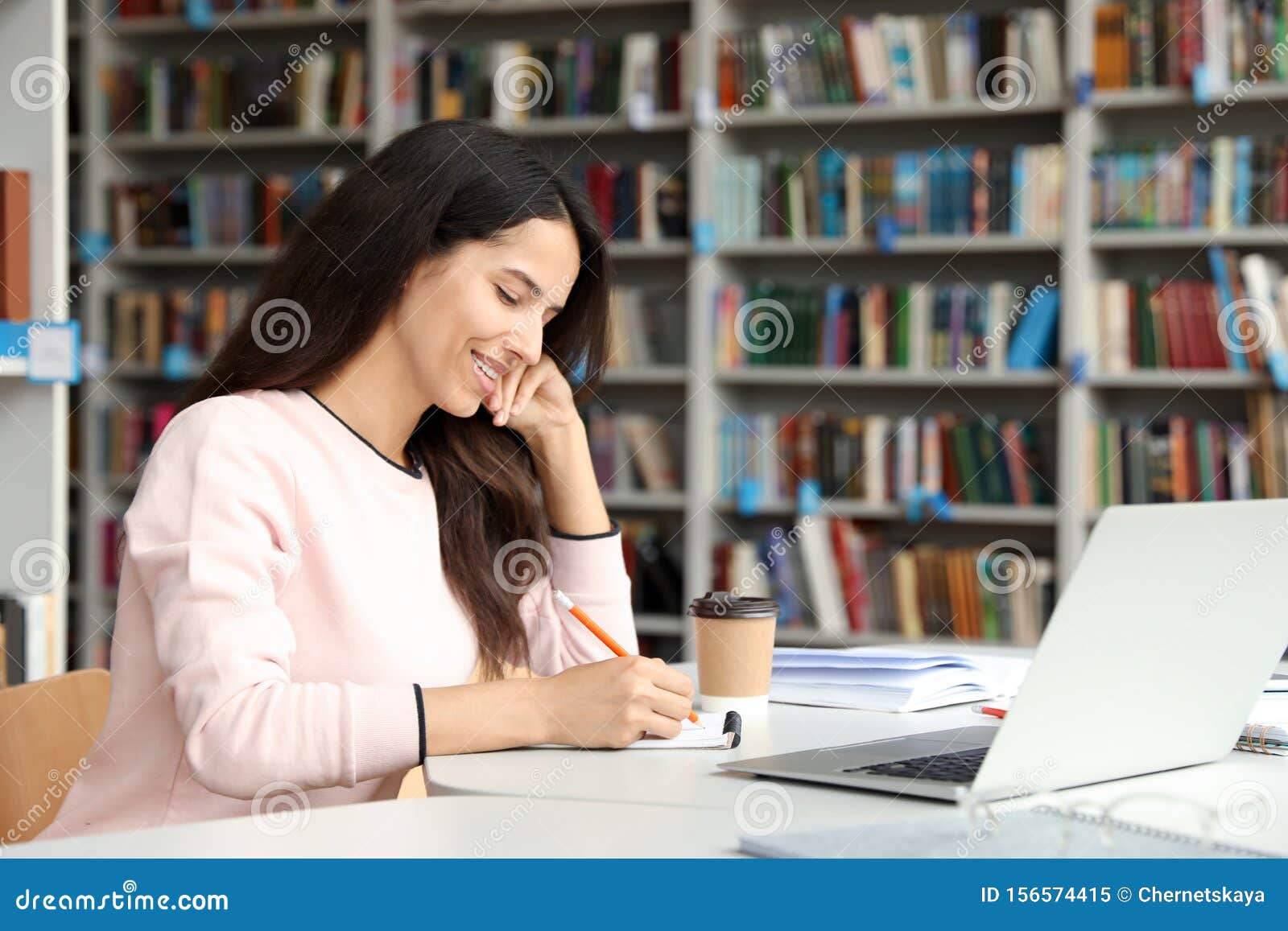 Young Woman Studying at Table in Stock Image - Image of academic ...