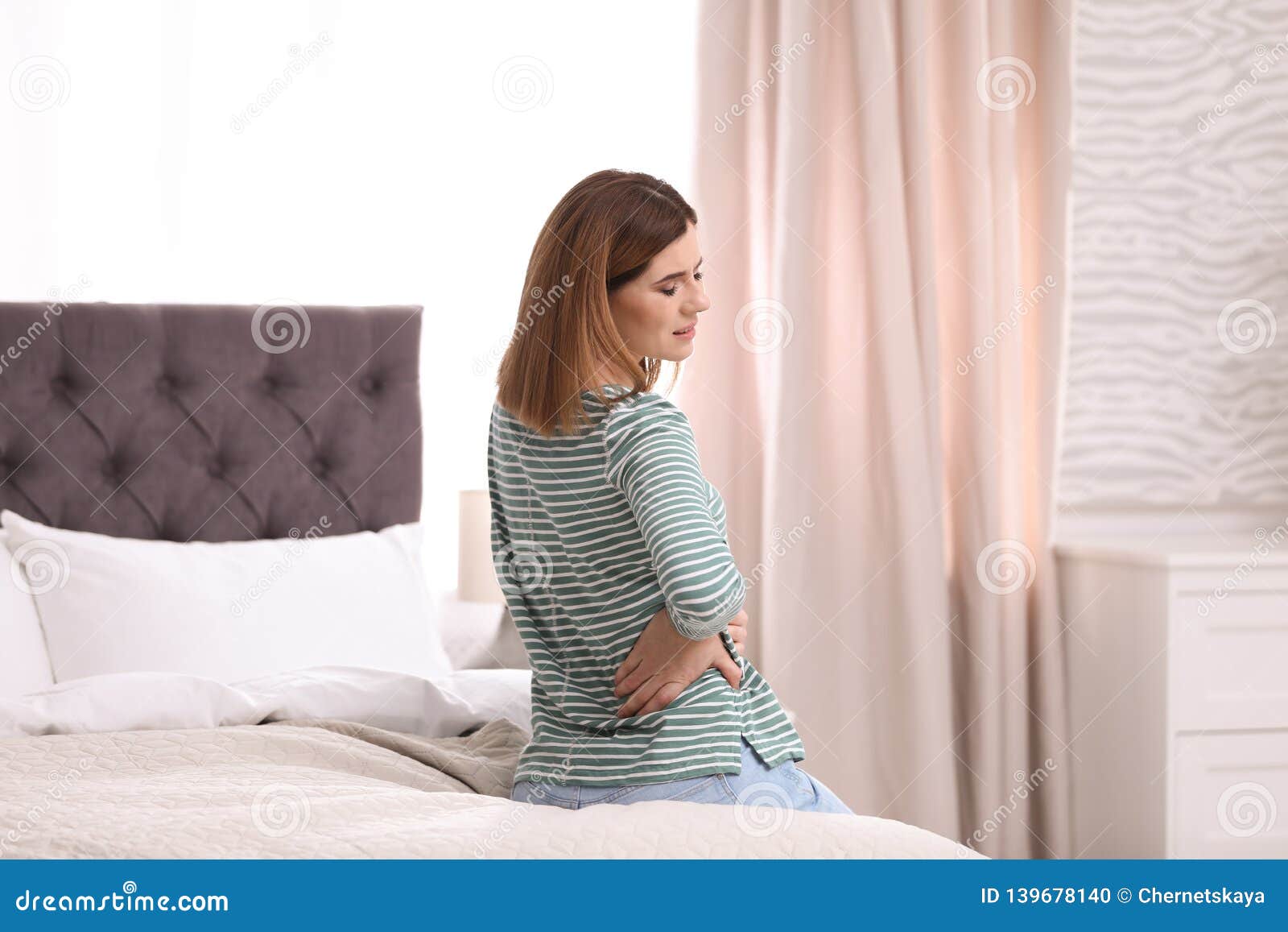 Young Woman Suffering from Back Pain Stock Photo - Image of bedroom ...