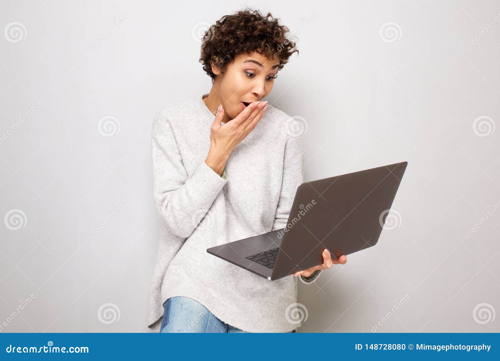 Young Woman with Surprised Expression when Looking at Laptop Computer ...