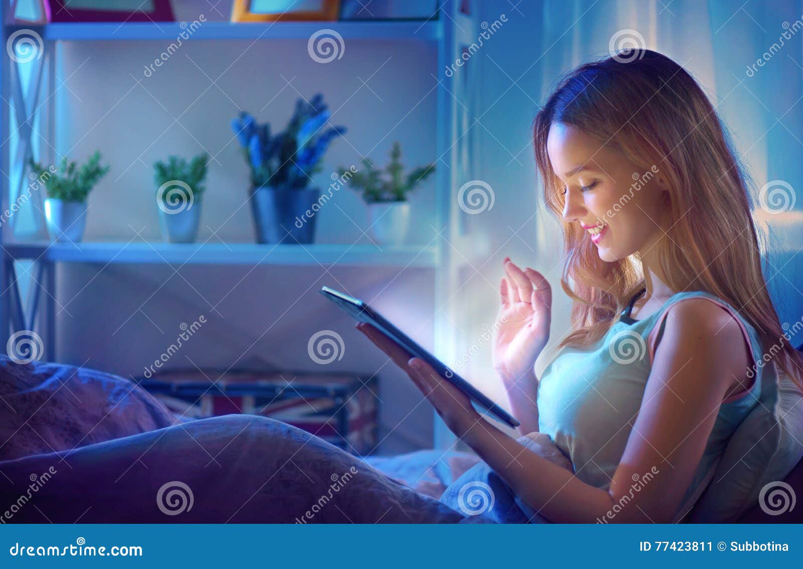 Young Woman with Tablet Computer in a Dark Room Stock Image - Image of ...