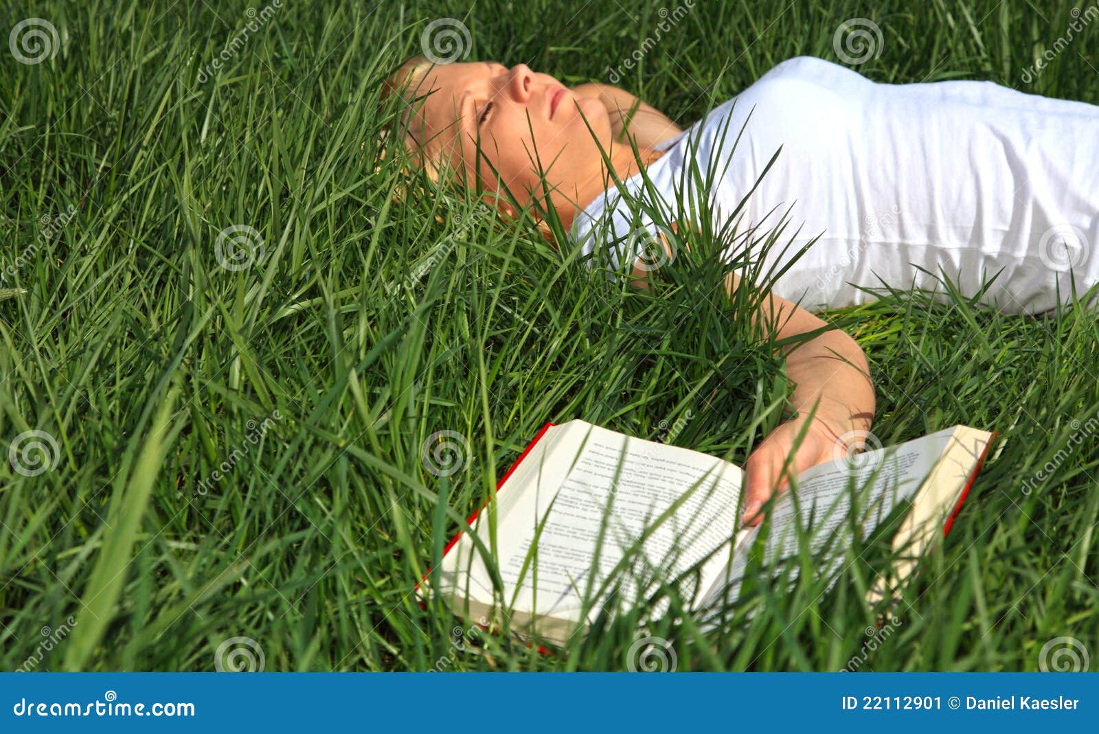 Young Woman Taking a Nap Outside Stock Image - Image of field, sleeping ...