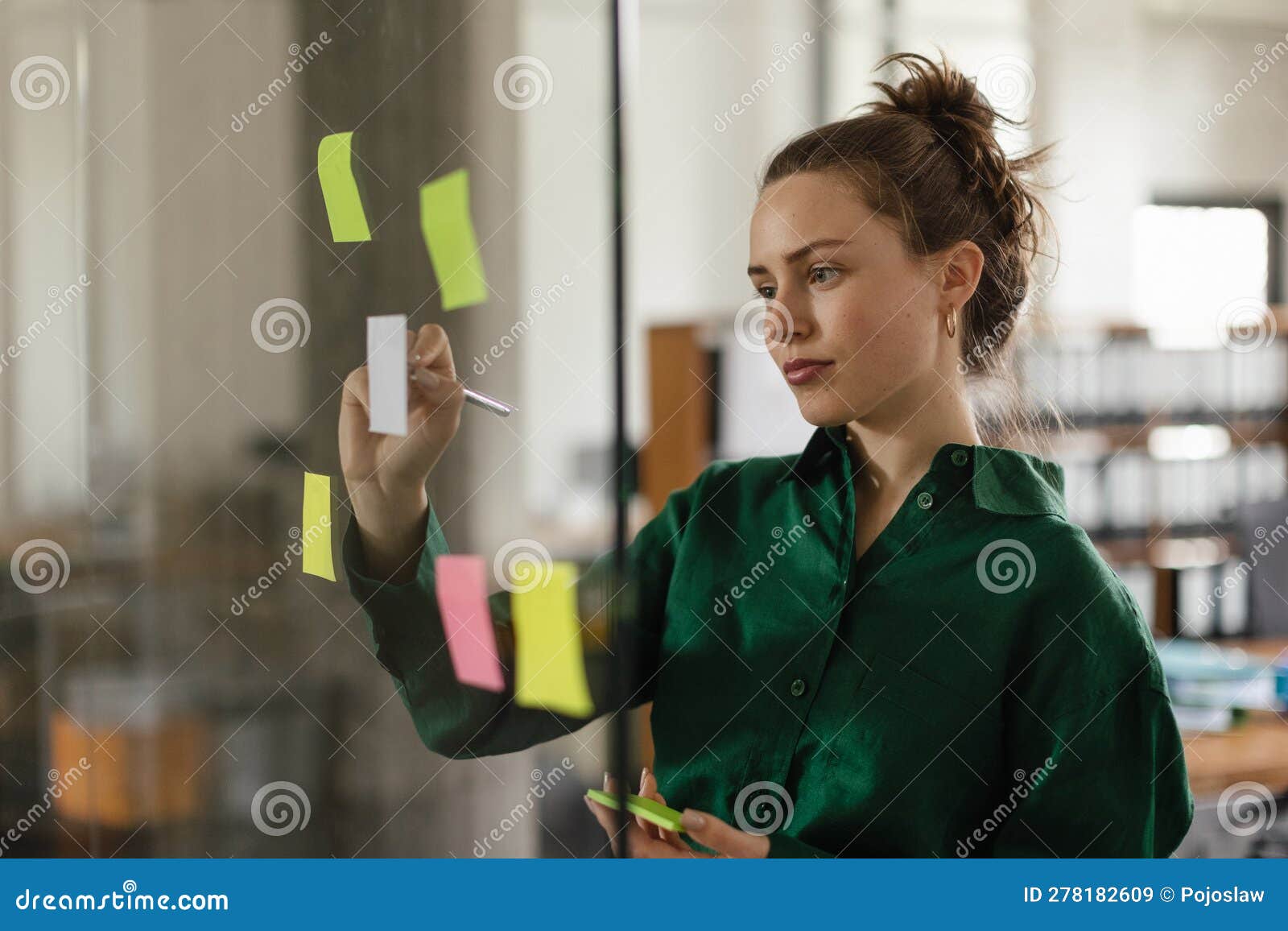 Young Woman Taking Notes in Her Office. Stock Image - Image of paper ...