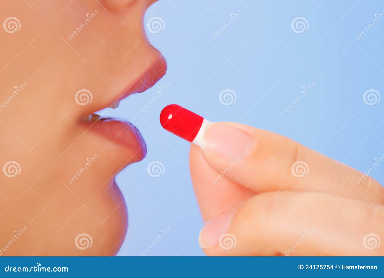 Young Woman Taking Red and White Bolus Stock Photo - Image of eating ...