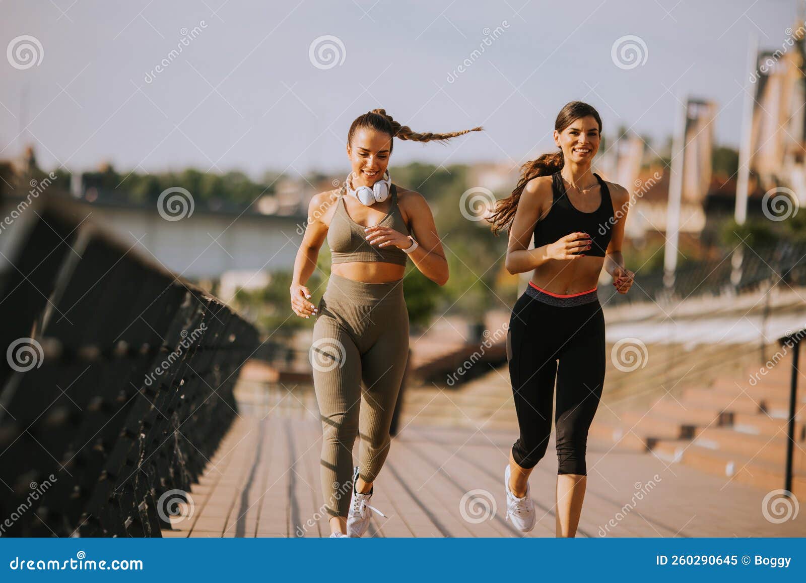 Young Woman Taking Running Exercise by the River Promenade Stock Image ...