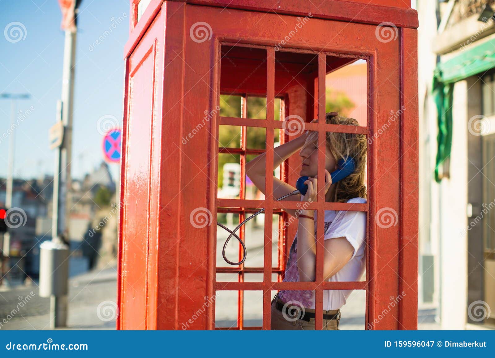 Young Woman Talking in a Phone Booth. Love. Stock Image - Image of ...