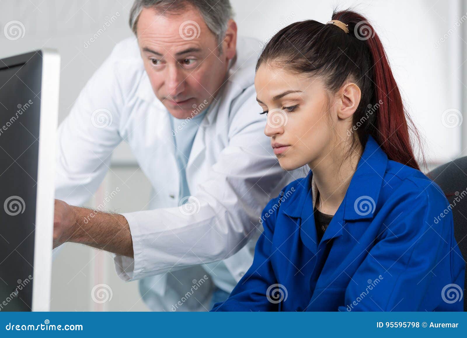 Young Woman and Teacher in Computer Class Stock Photo - Image of office ...