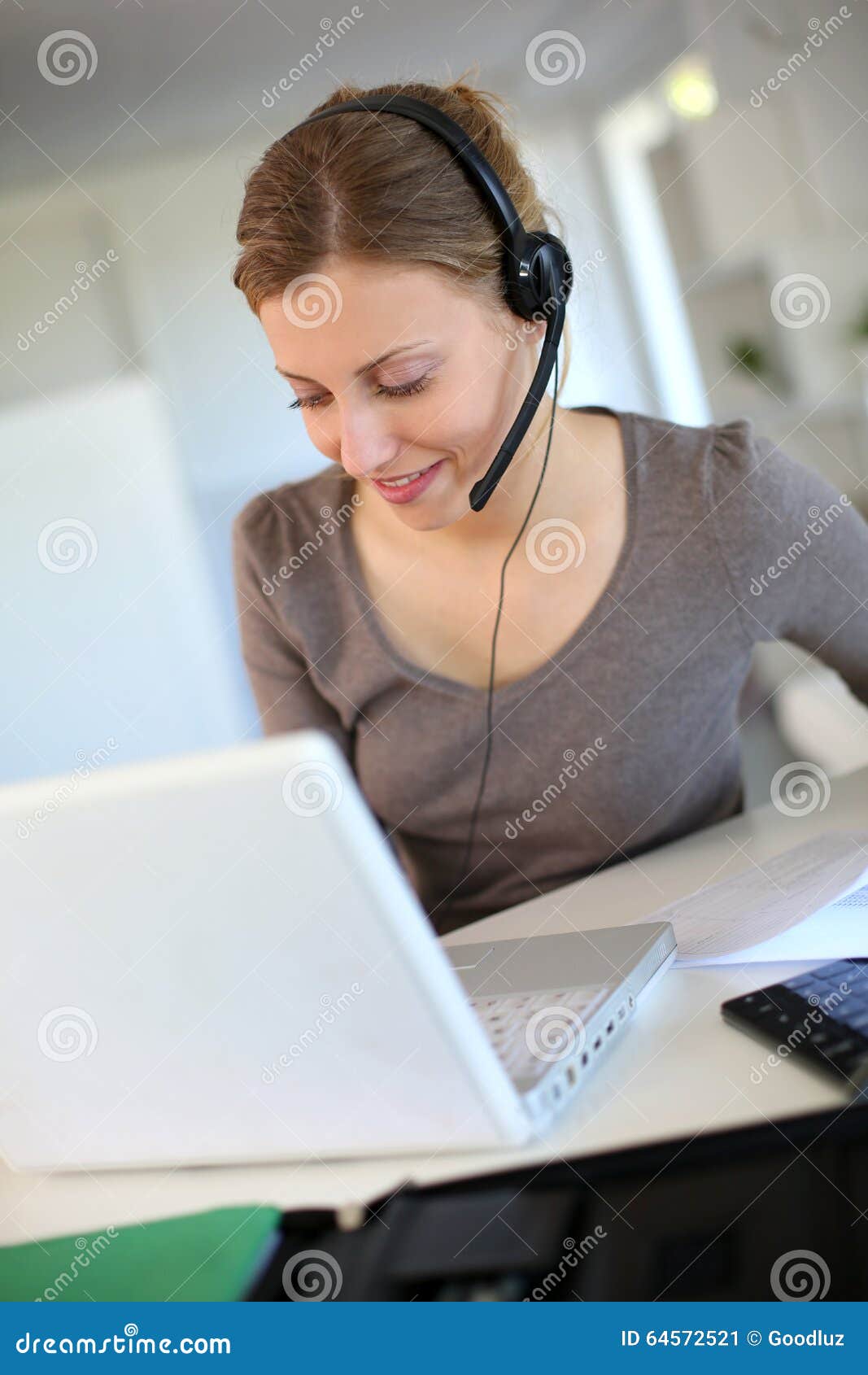 Young Woman Teleworking on Laptop with Headset Stock Image - Image of ...