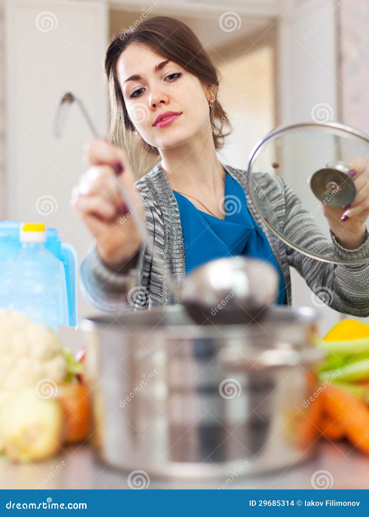 Young Woman Tests Food with Ladle Stock Photo - Image of people ...