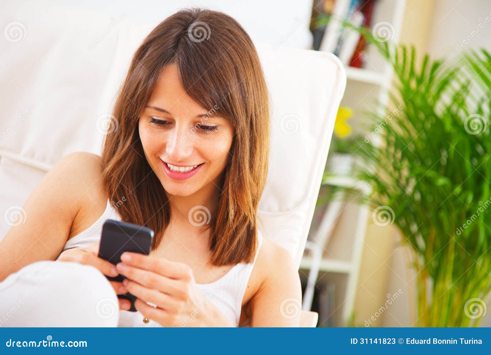 Young Woman Texting with Her Smartphone Stock Image - Image of couch ... Young Woman Texting with Her Smartphone Stock Image - Image of couch ...