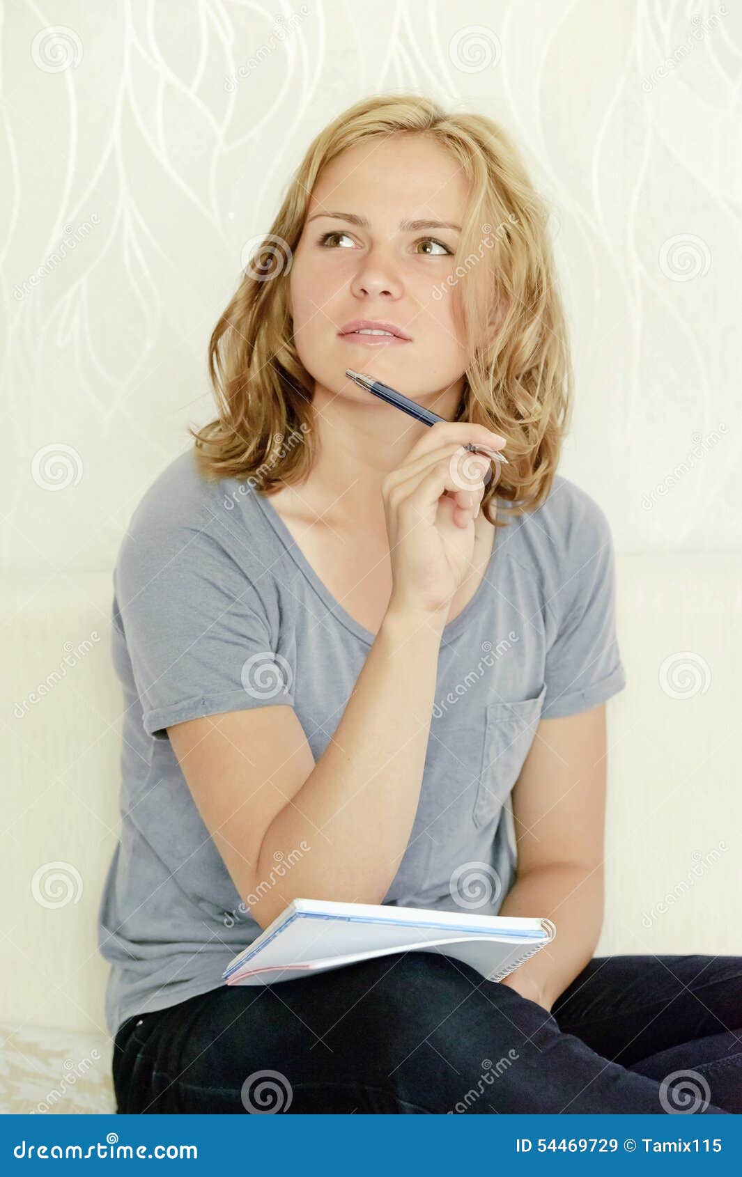 Young Woman Thinking Over Making Notes in Notebook Stock Image - Image ...