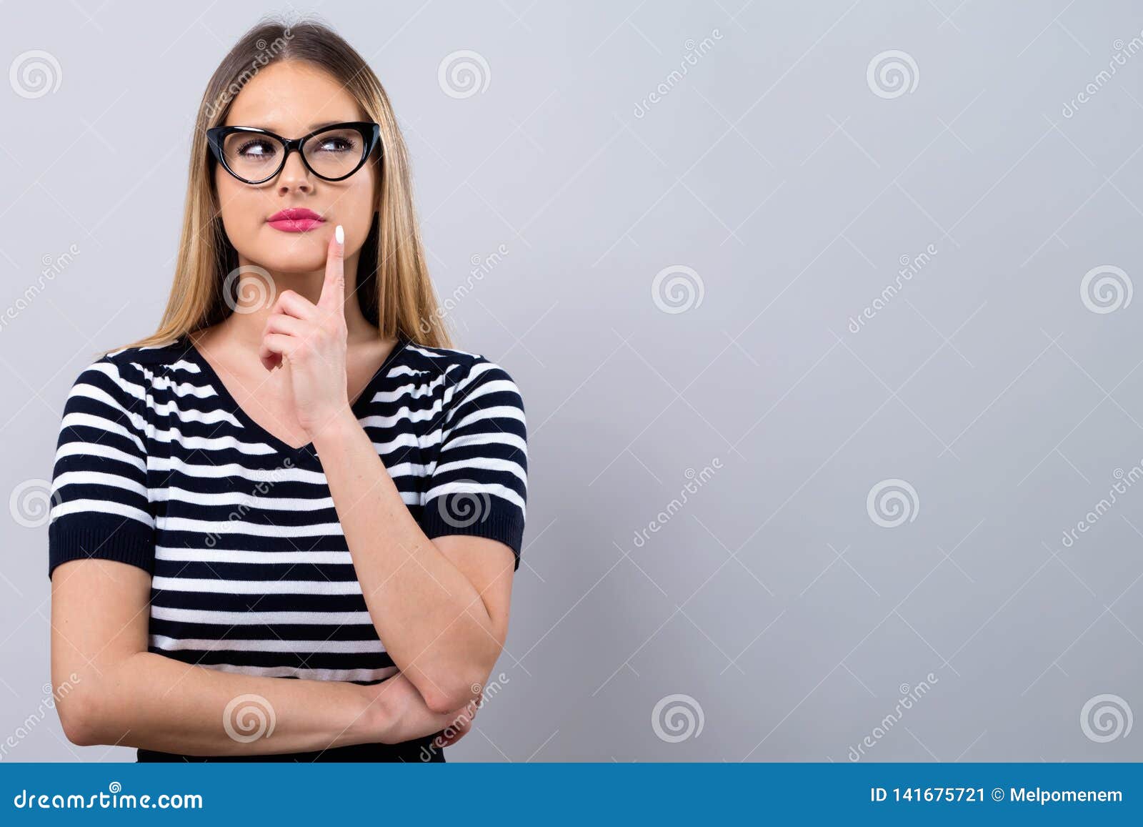 Young Woman in a Thoughtful Pose Stock Image - Image of imagining ... Young Woman in a Thoughtful Pose Stock Image - Image of imagining ...