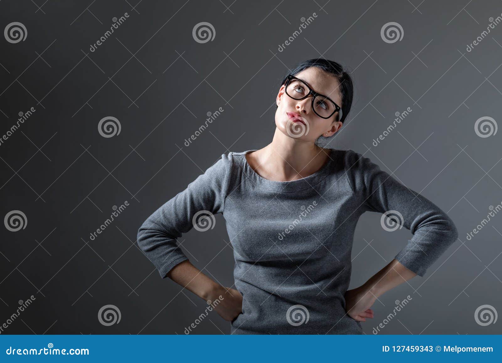 Young Woman in a Thoughtful Pose Stock Image - Image of background ...