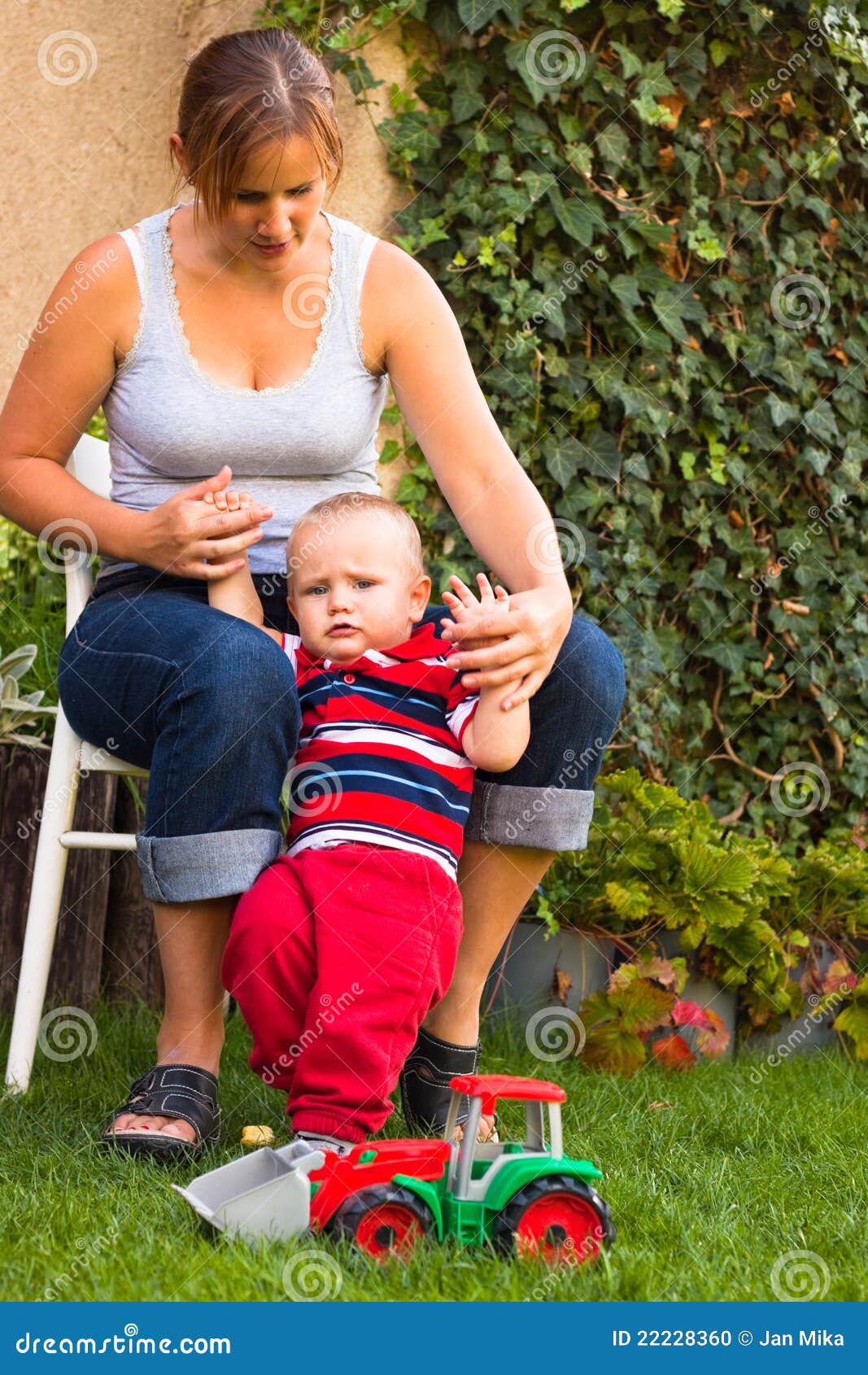 Young Woman and Toddler Relaxing Outdoors Stock Photo - Image of ...