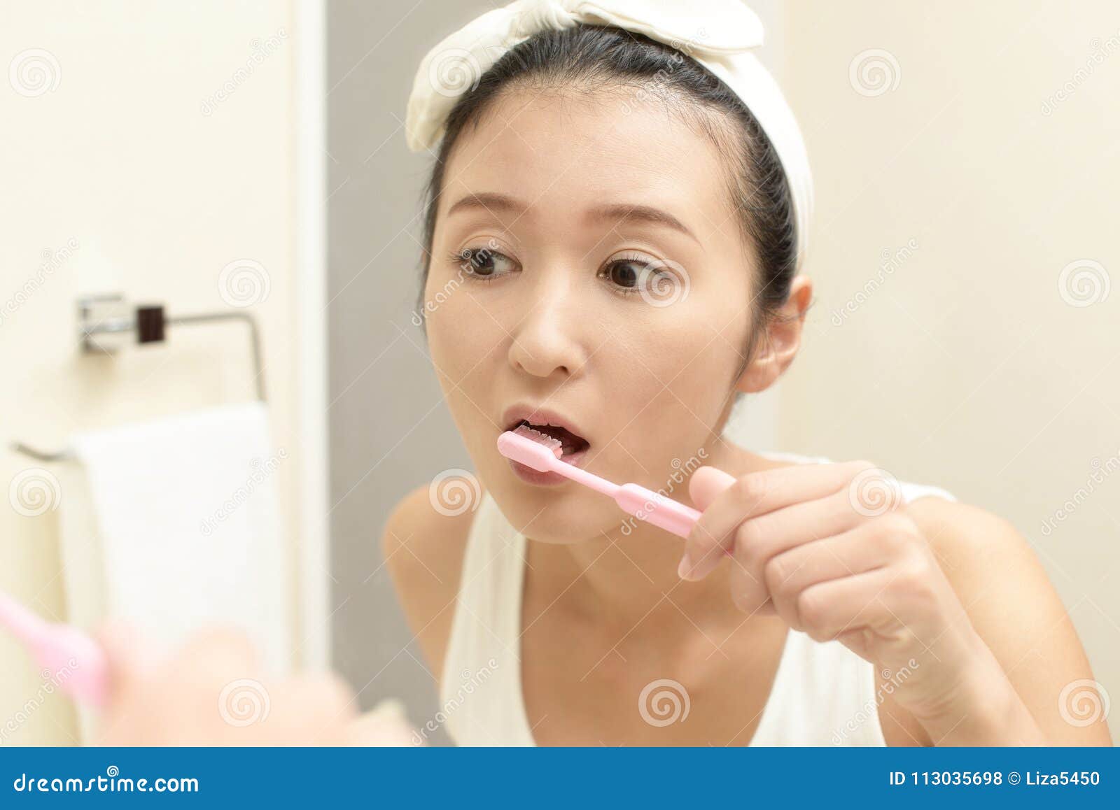 Woman brushing her teeth stock photo. Image of care - 113035698
